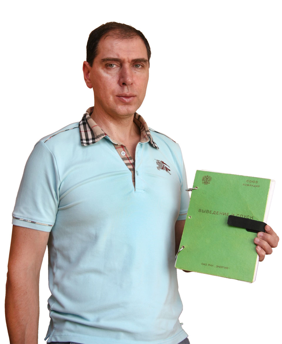 Sergey Volkov holding the onboard journal