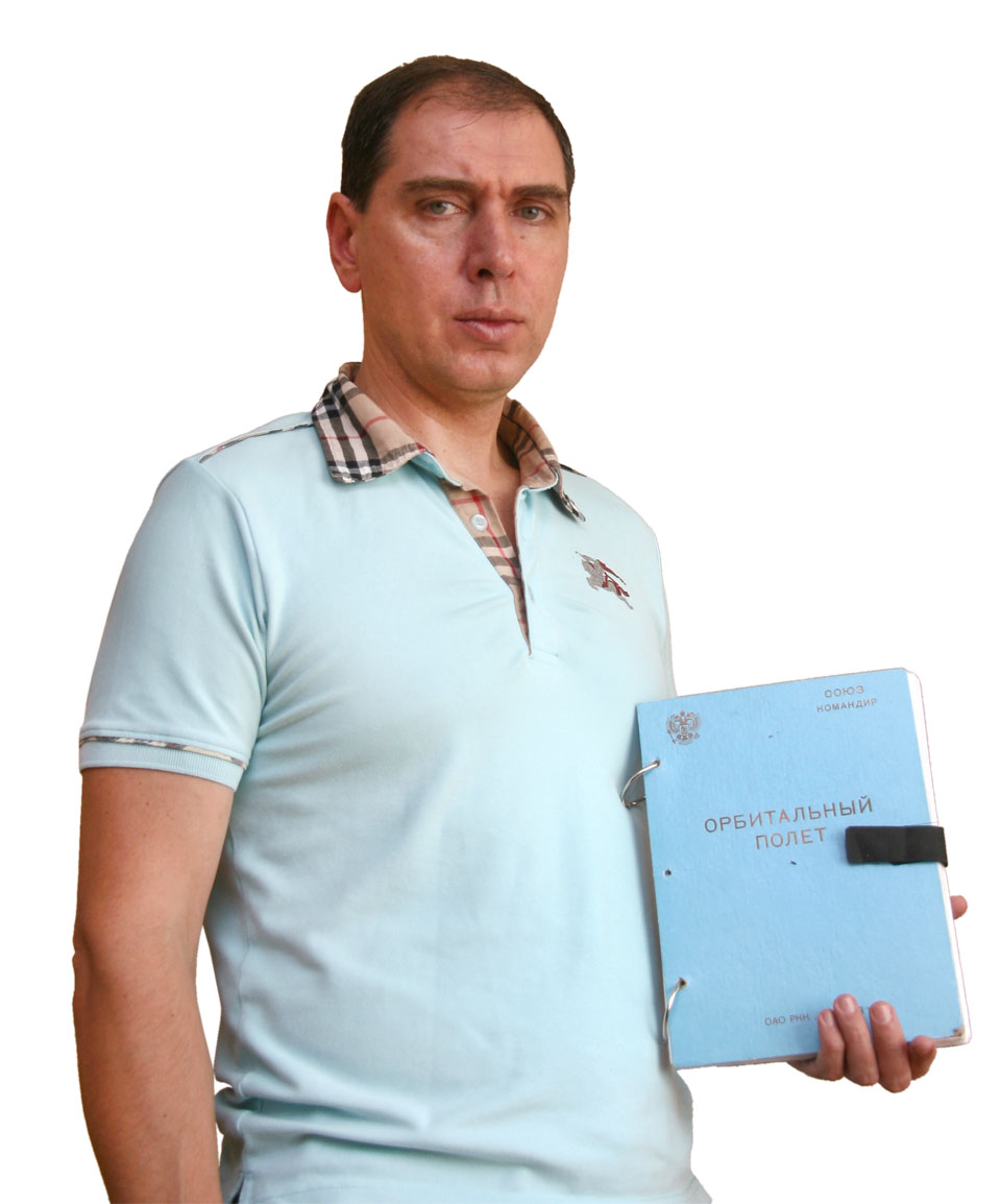 Sergey Volkov holding the onboard journal